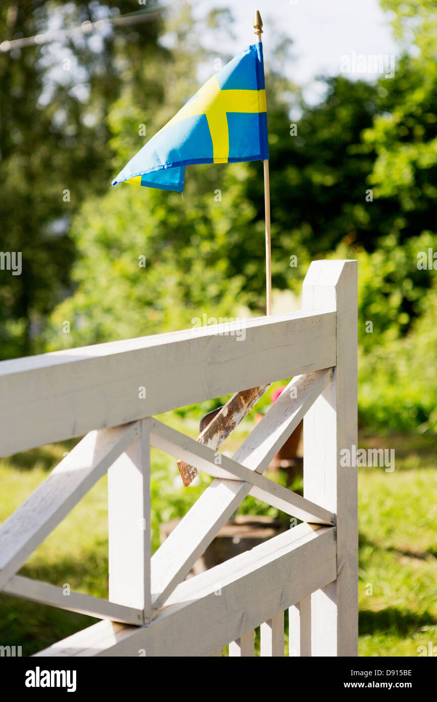 Swiss flag on wooden gate Stock Photo - Alamy