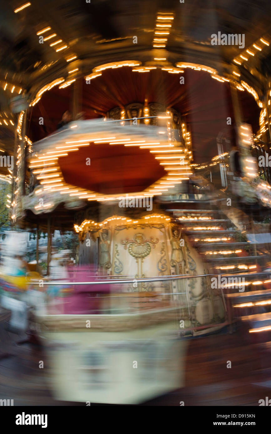 Merry-go-round in movement Stock Photo - Alamy