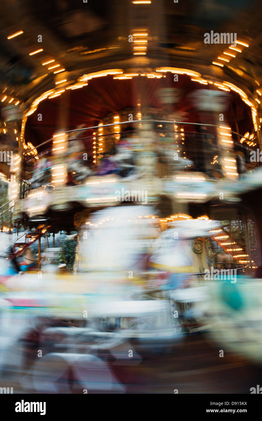 Merry-go-round in movement Stock Photo - Alamy
