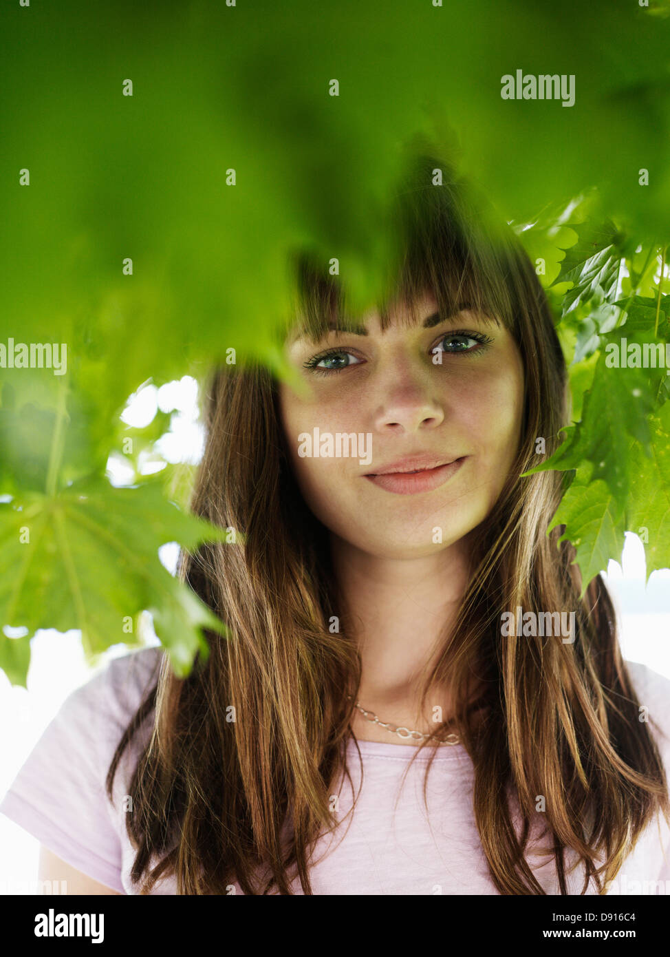 Woman under tree hi-res stock photography and images - Alamy