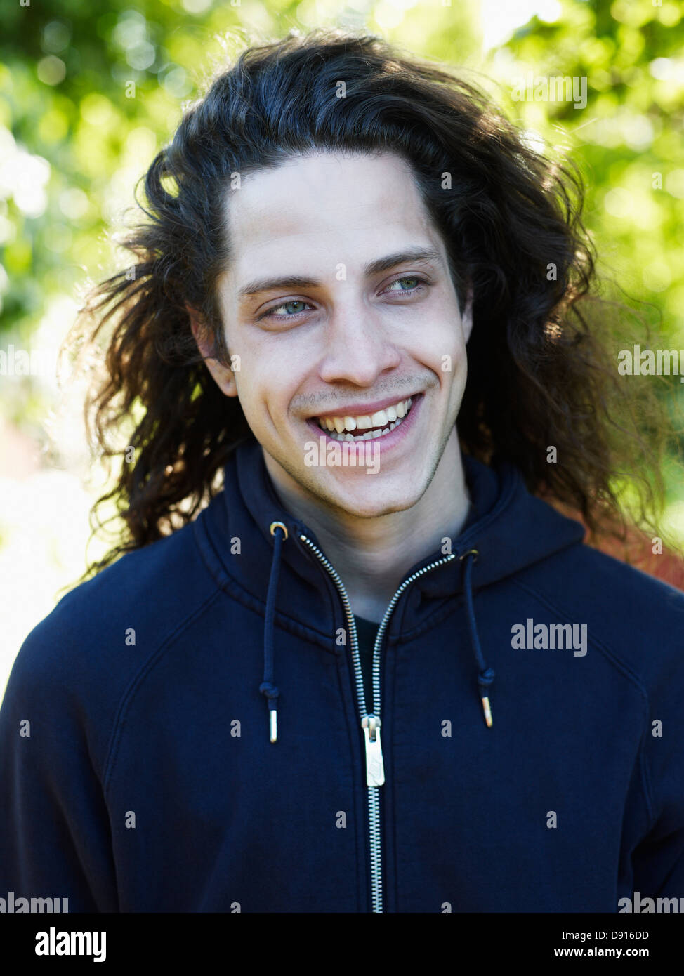Portrait of young man smiling Stock Photo - Alamy