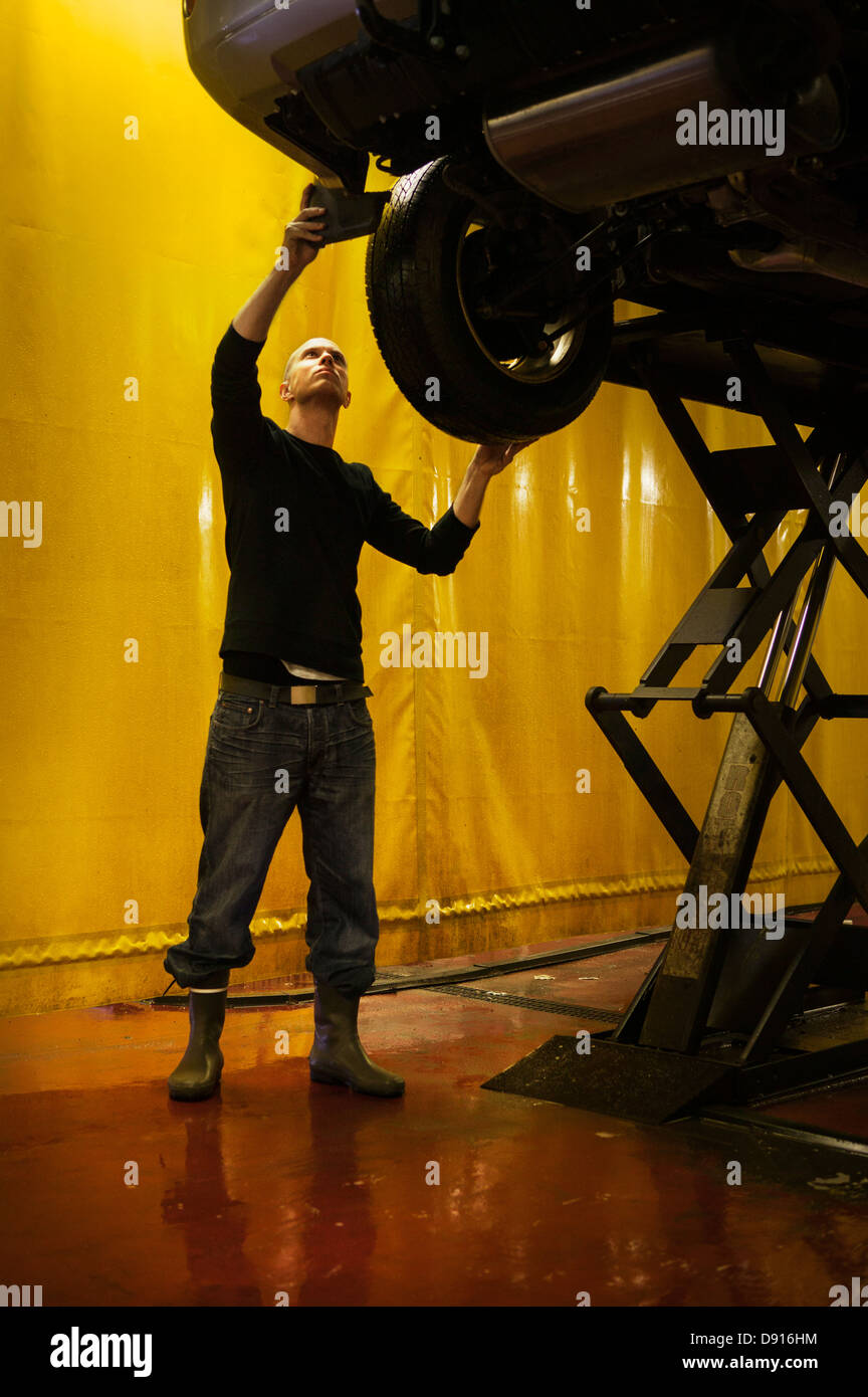 Mechanic standing in garage hi-res stock photography and images - Alamy