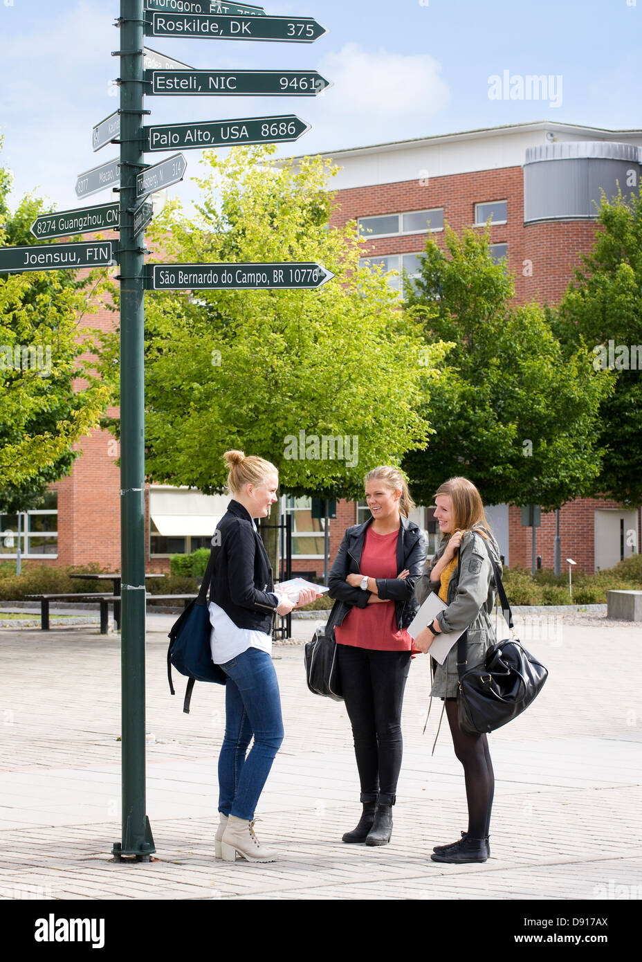Students outside university building Stock Photo - Alamy