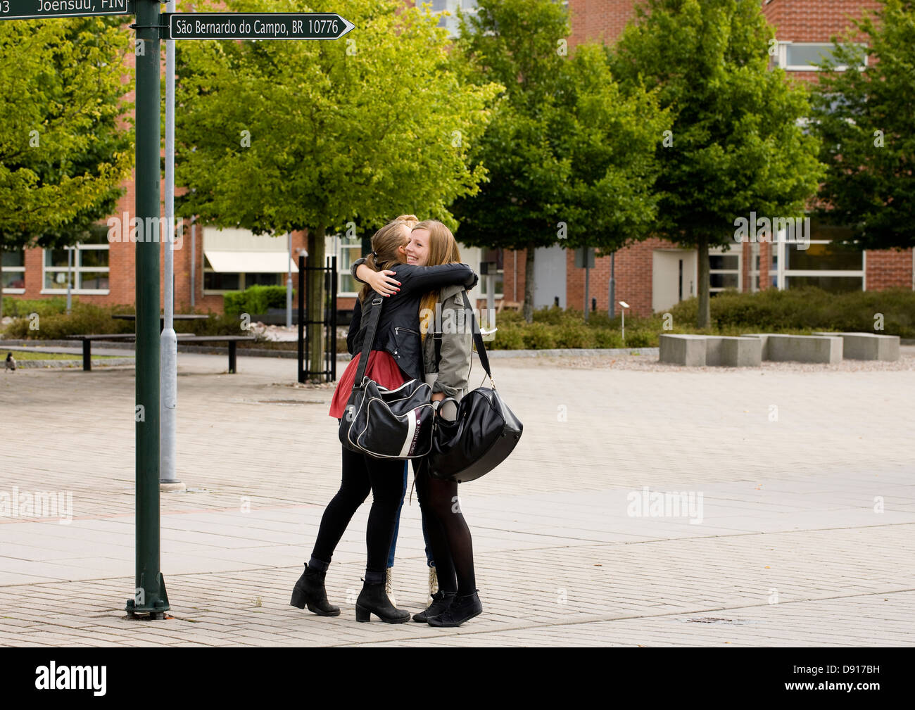 Students outside university building Stock Photo - Alamy