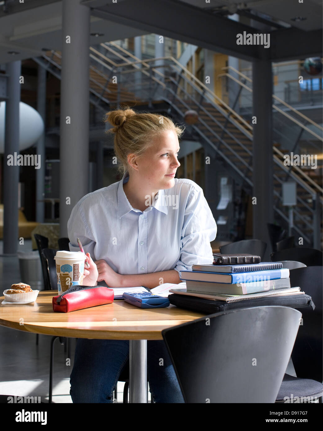 University student sitting in cafe Stock Photo - Alamy