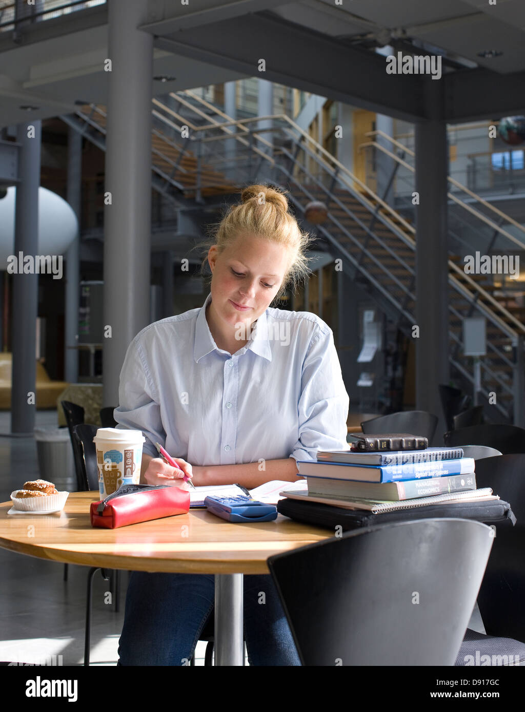 University student sitting in cafe Stock Photo - Alamy