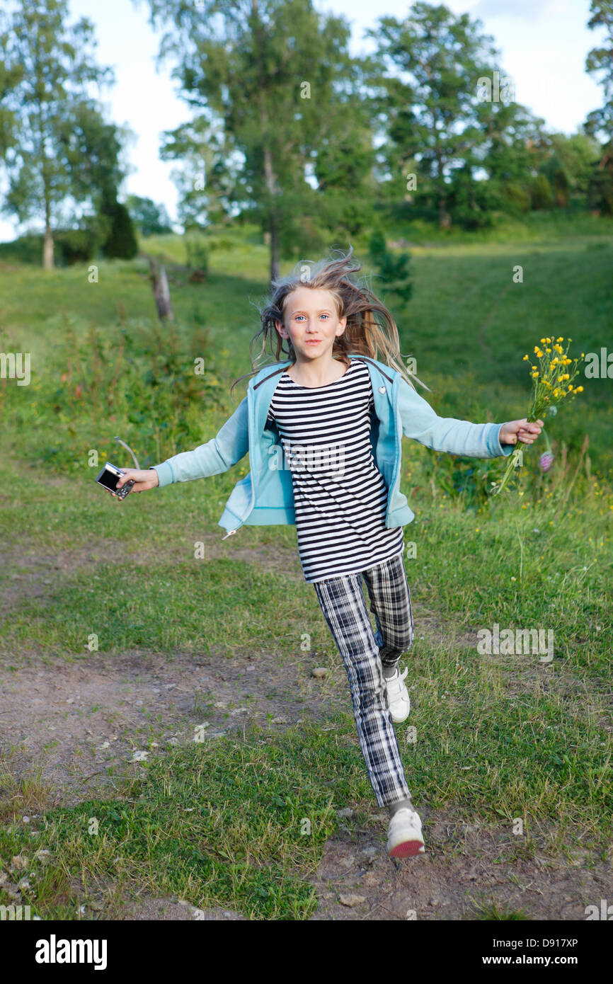 Blonde girl running hi-res stock photography and images - Alamy