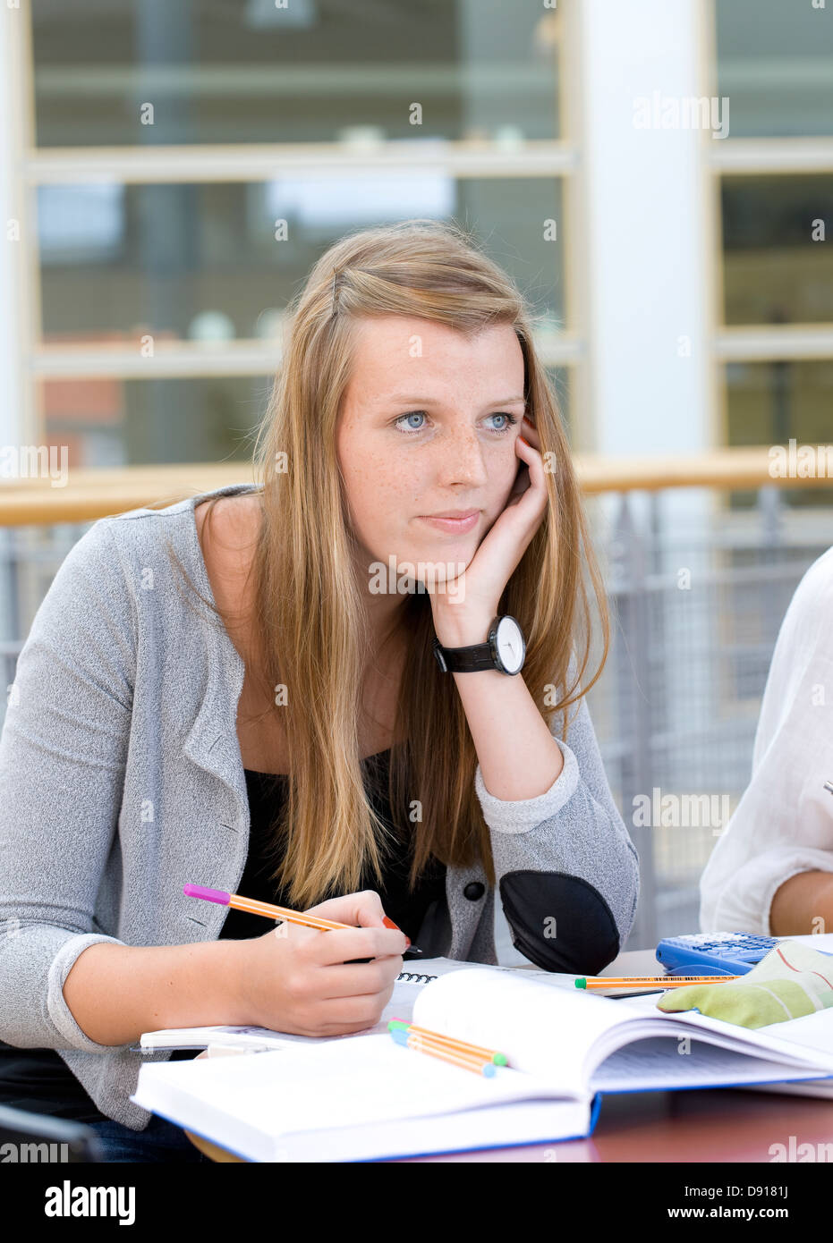 Smiling university student Stock Photo - Alamy