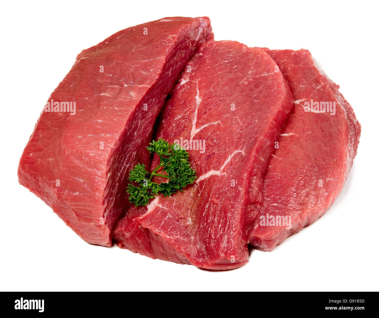 Raw sliced meat with green parsley, isolated Stock Photo - Alamy
