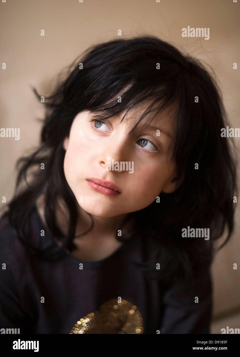 Portrait of a girl thinking Stock Photo - Alamy