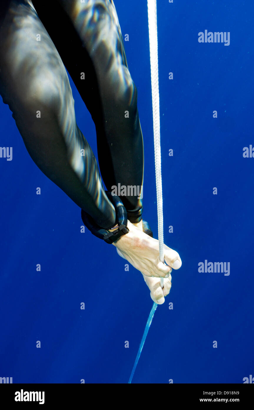 A diver holding a rope with his toes, Egypt Stock Photo - Alamy