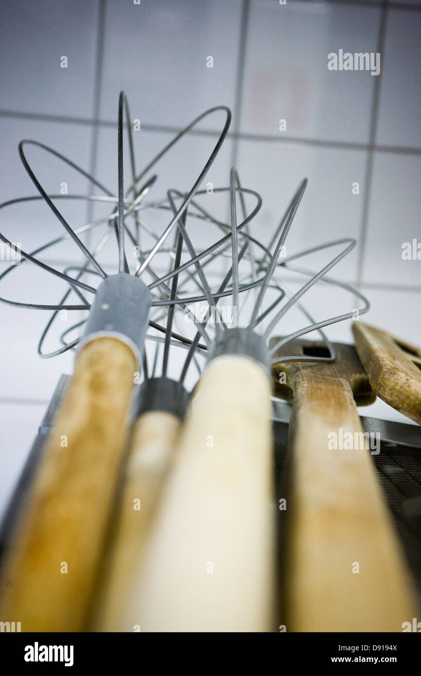 Whisks in a kitchen, close-up Stock Photo - Alamy