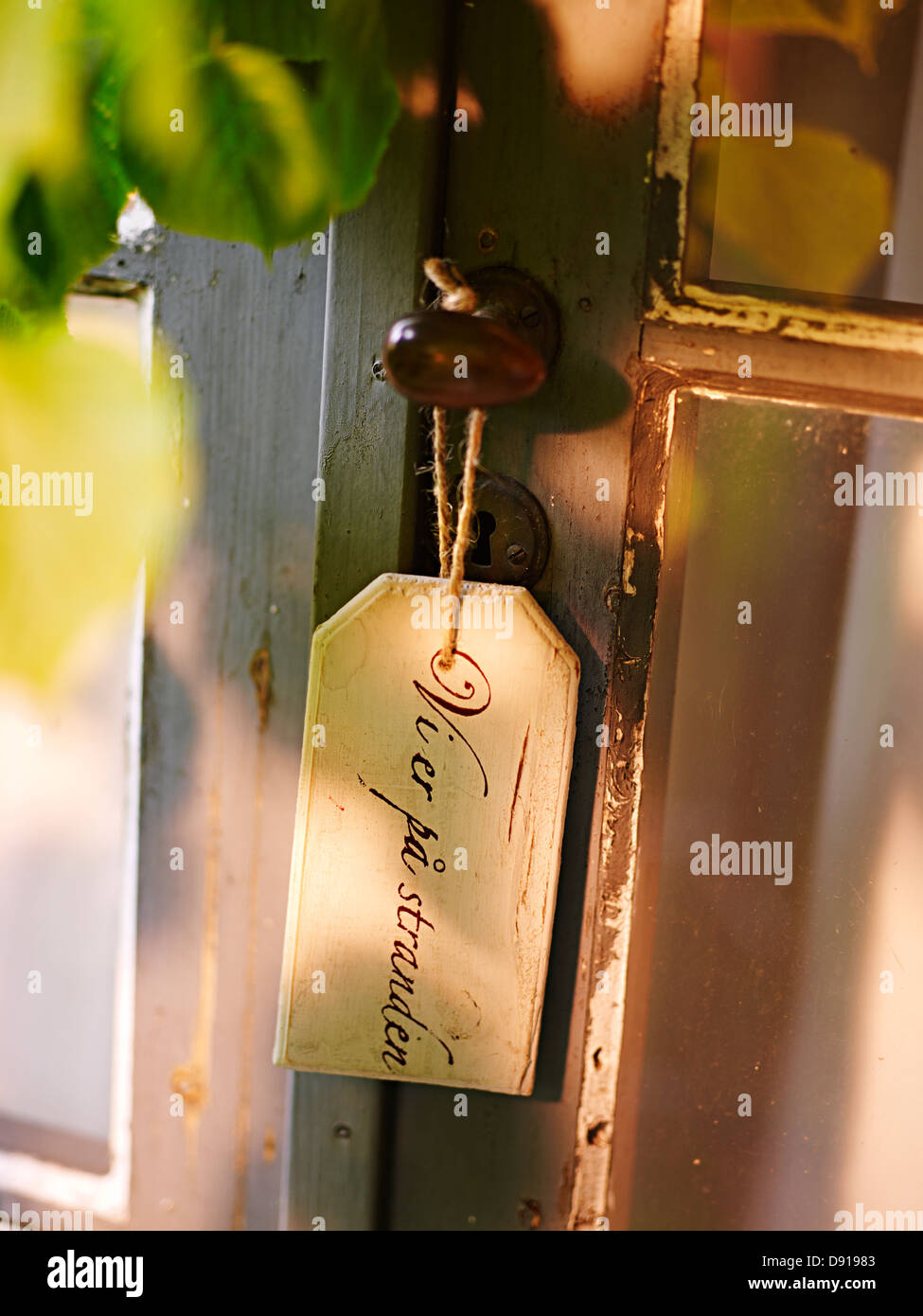 An old door with a sign Stock Photo - Alamy