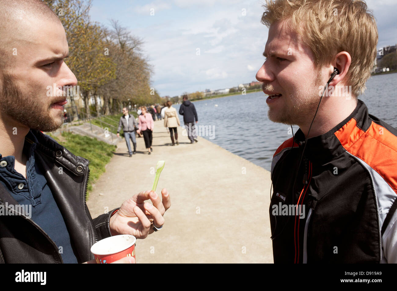 Two men talking outside Stock Photo - Alamy