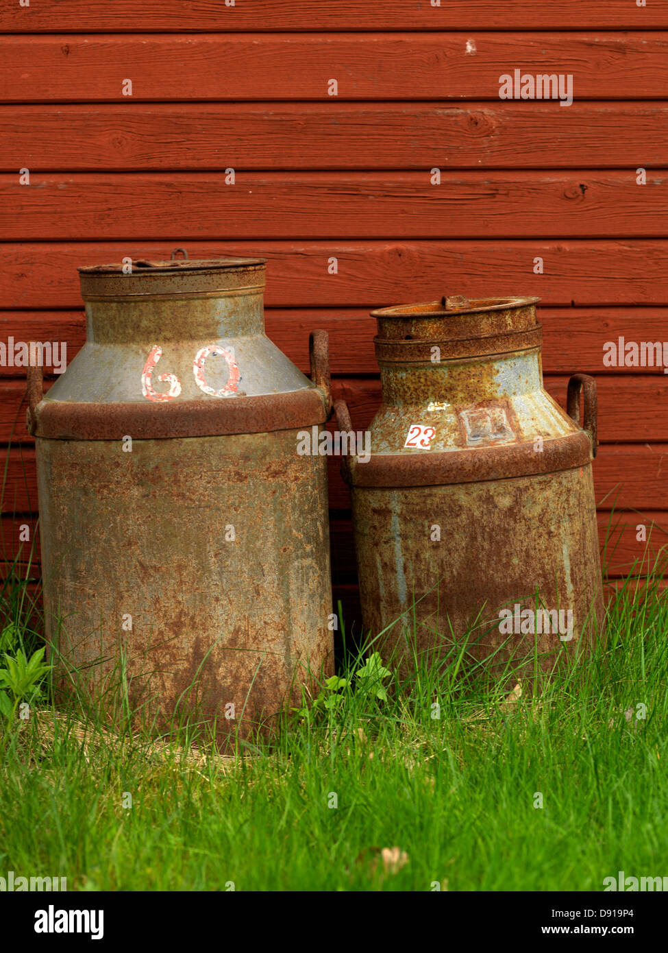 Two old milk cans, Sweden Stock Photo - Alamy
