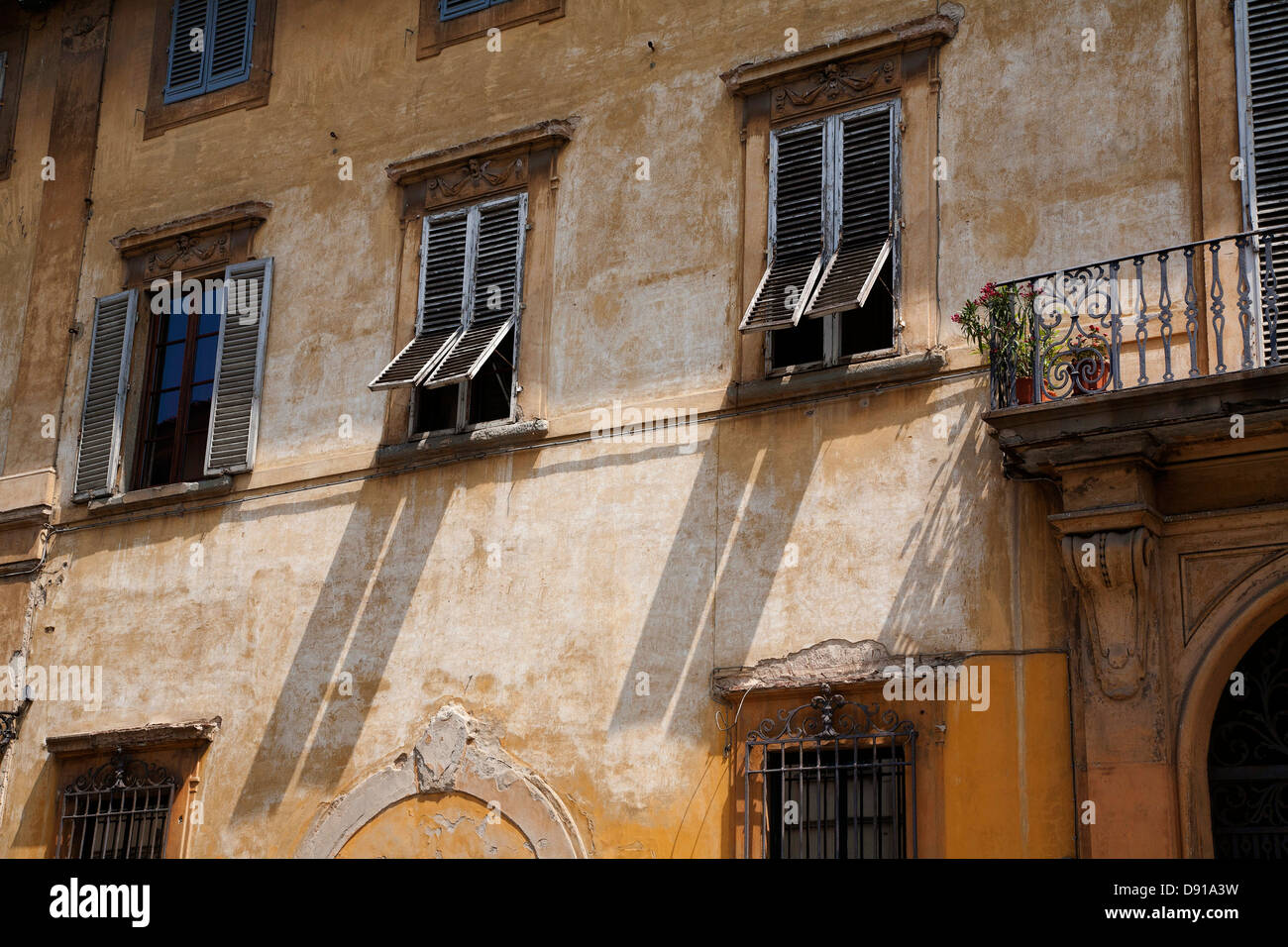 Shutters and shadows on windows Stock Photo - Alamy