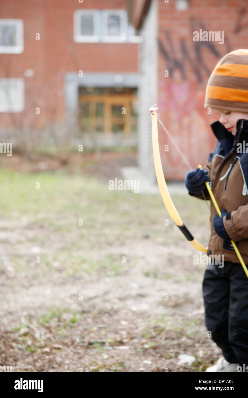 Boy with bow hi-res stock photography and images - Alamy