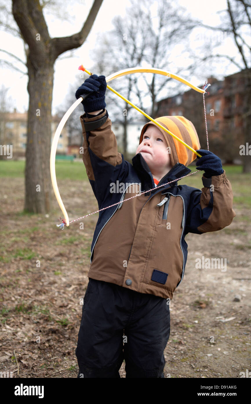 Boy with bow hi-res stock photography and images - Alamy