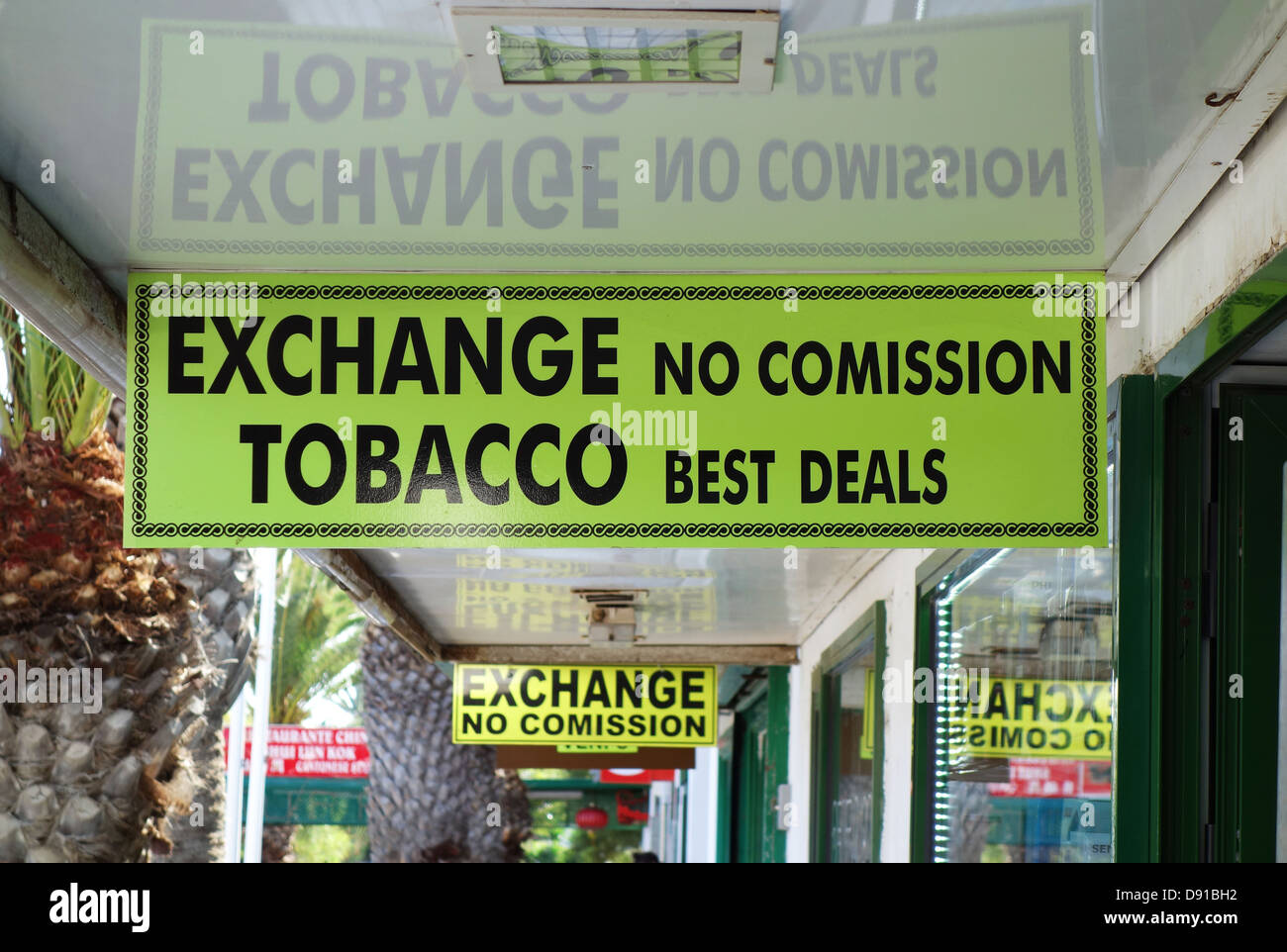 Currency exchange sign and tobacco sales sign, Europe Stock Photo - Alamy