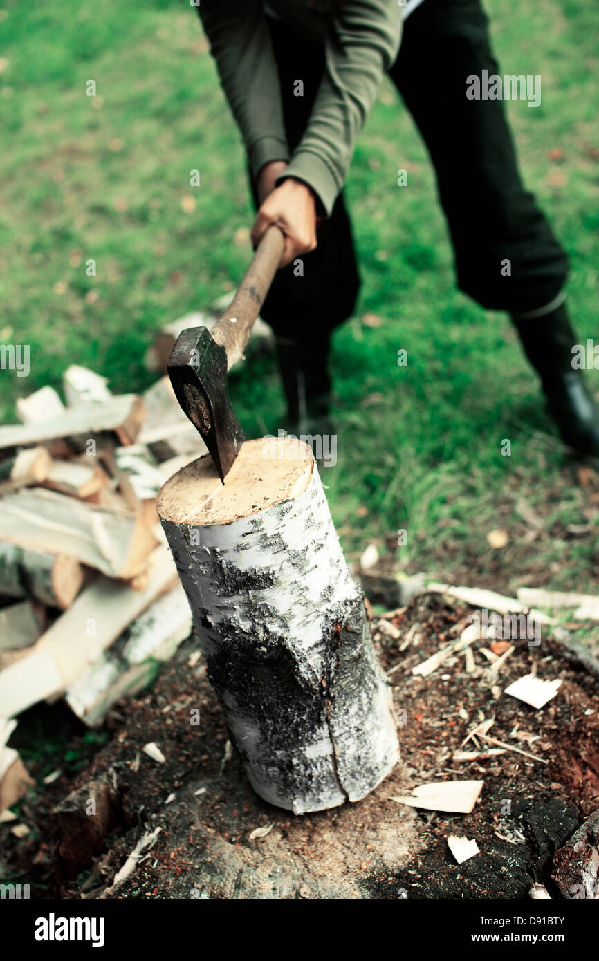 A woman chopping wood, Sweden Stock Photo - Alamy