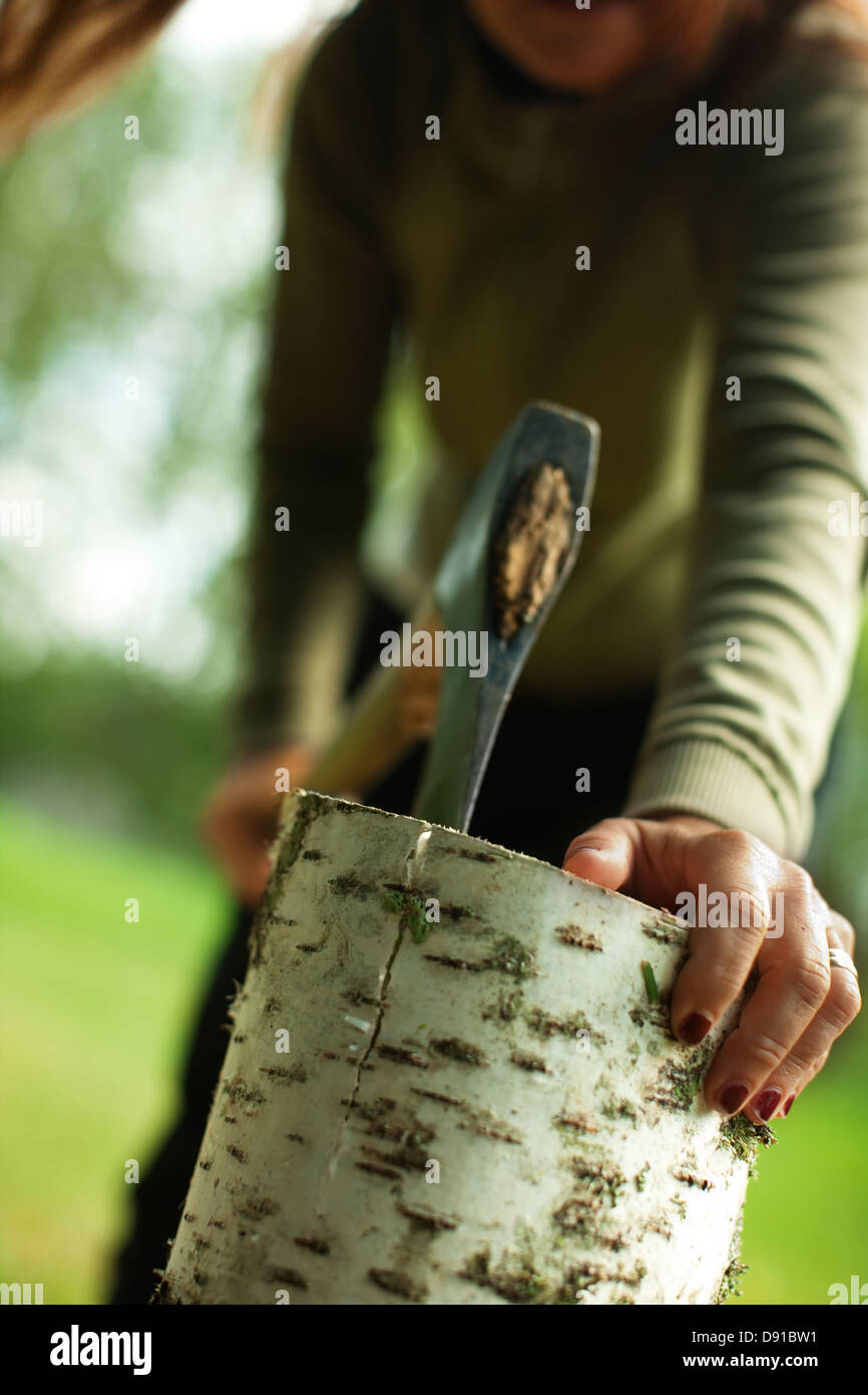 A woman chopping wood, Sweden Stock Photo - Alamy