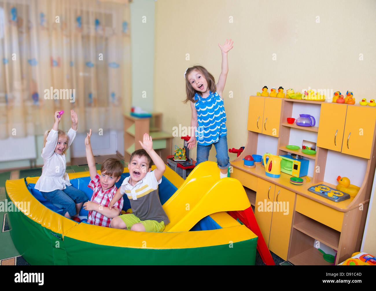 Happy excited children having fun at home Stock Photo - Alamy