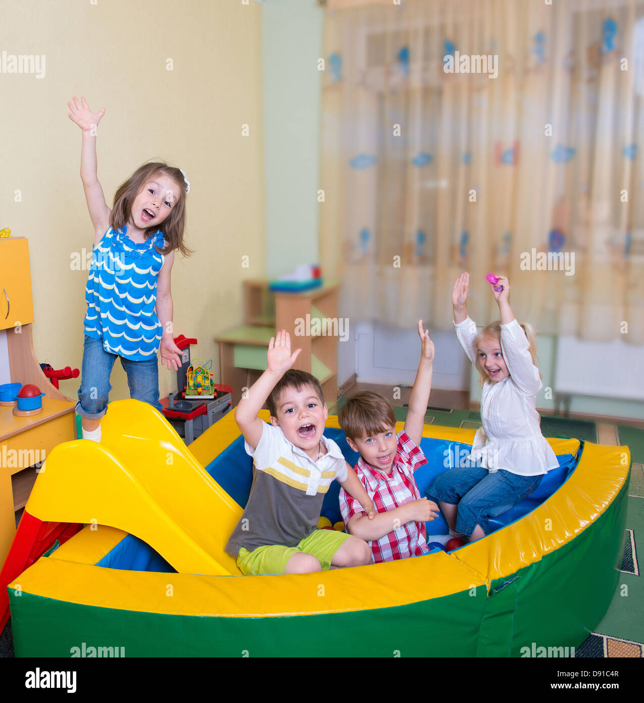 Happy excited children having fun at home Stock Photo - Alamy