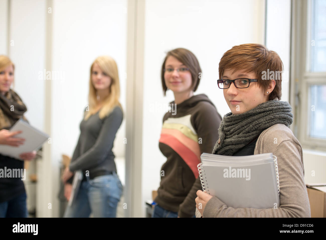 female students in university corridor near window Stock Photo - Alamy