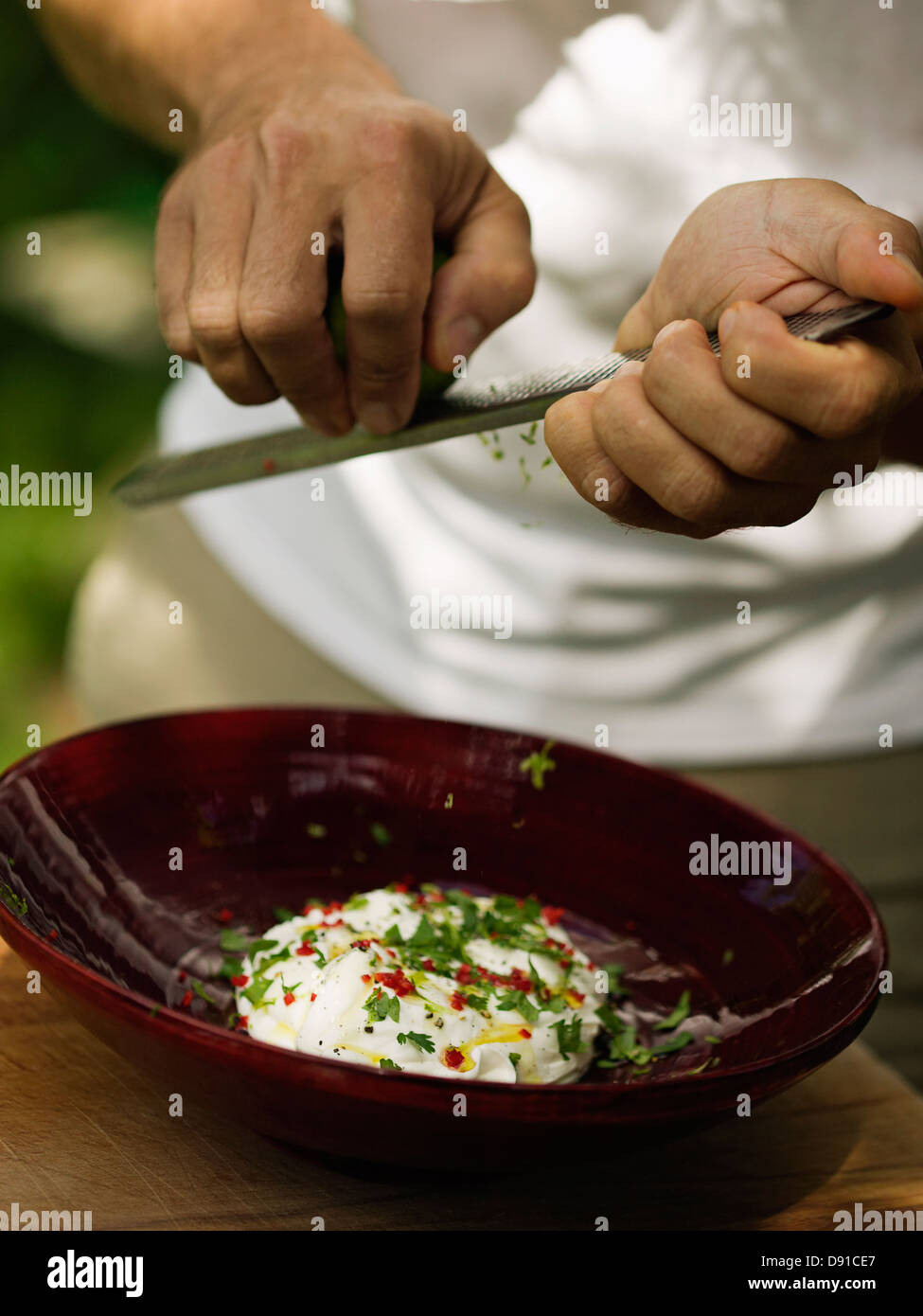 Man making a sauce with grated lime, Sweden Stock Photo - Alamy