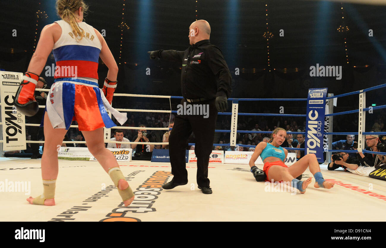 German kick boxer Christine Theiss (R) falls to the ground during her ...