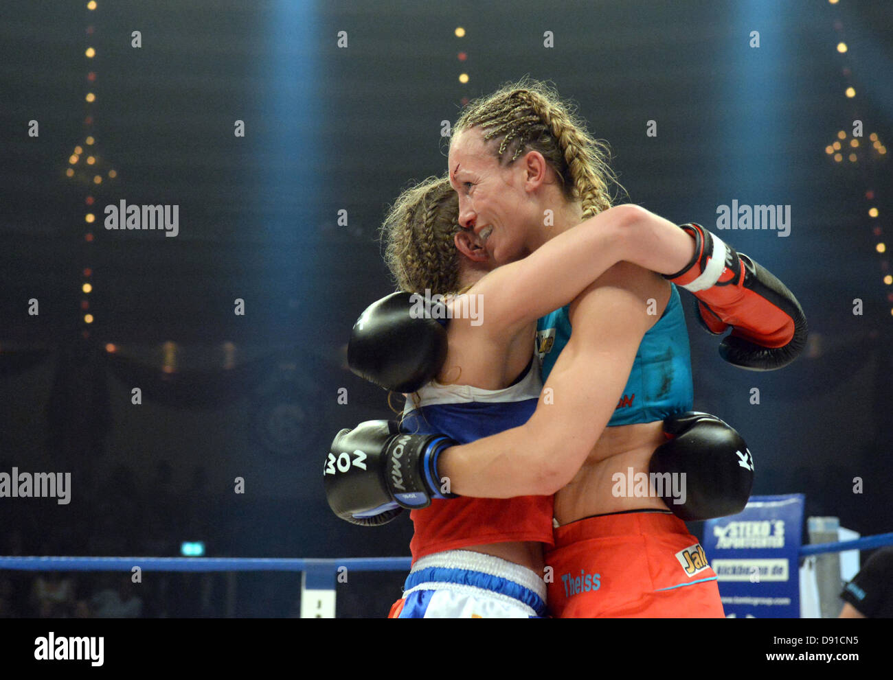 German kick boxer Christine Theiss (R) hugs her competitor Olga ...