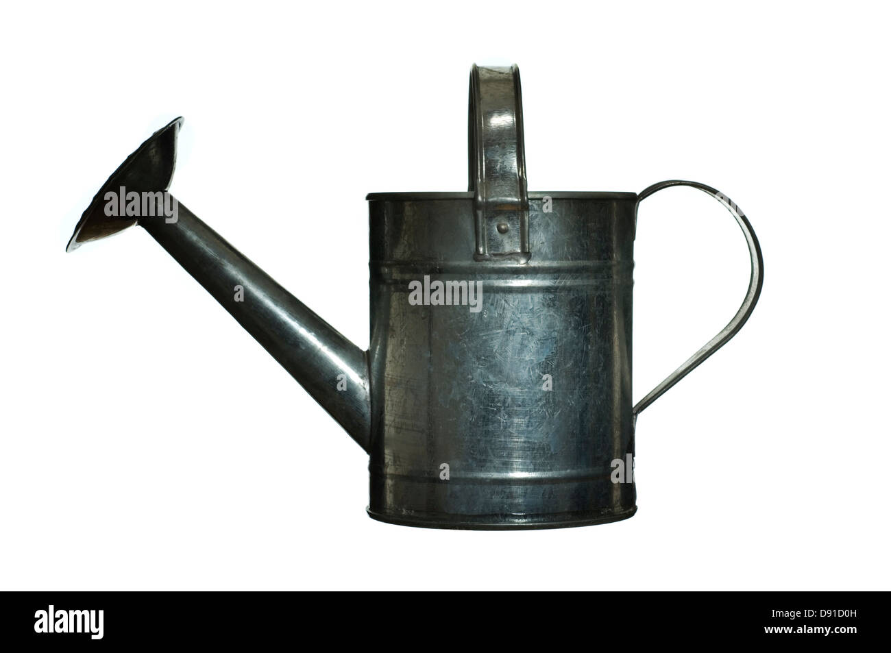 Watering can against white background Stock Photo - Alamy