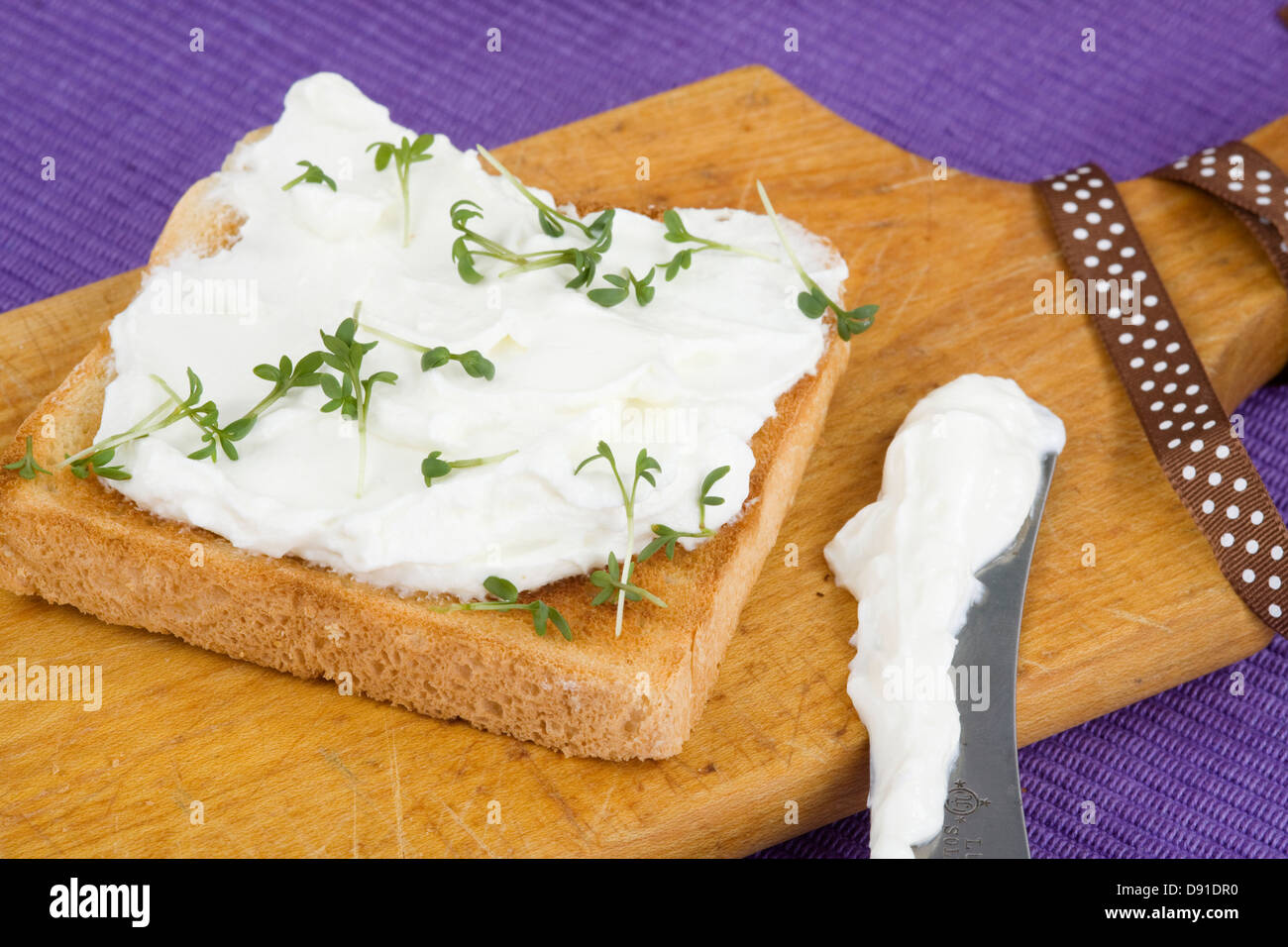 Toast with cream cheese Stock Photo - Alamy