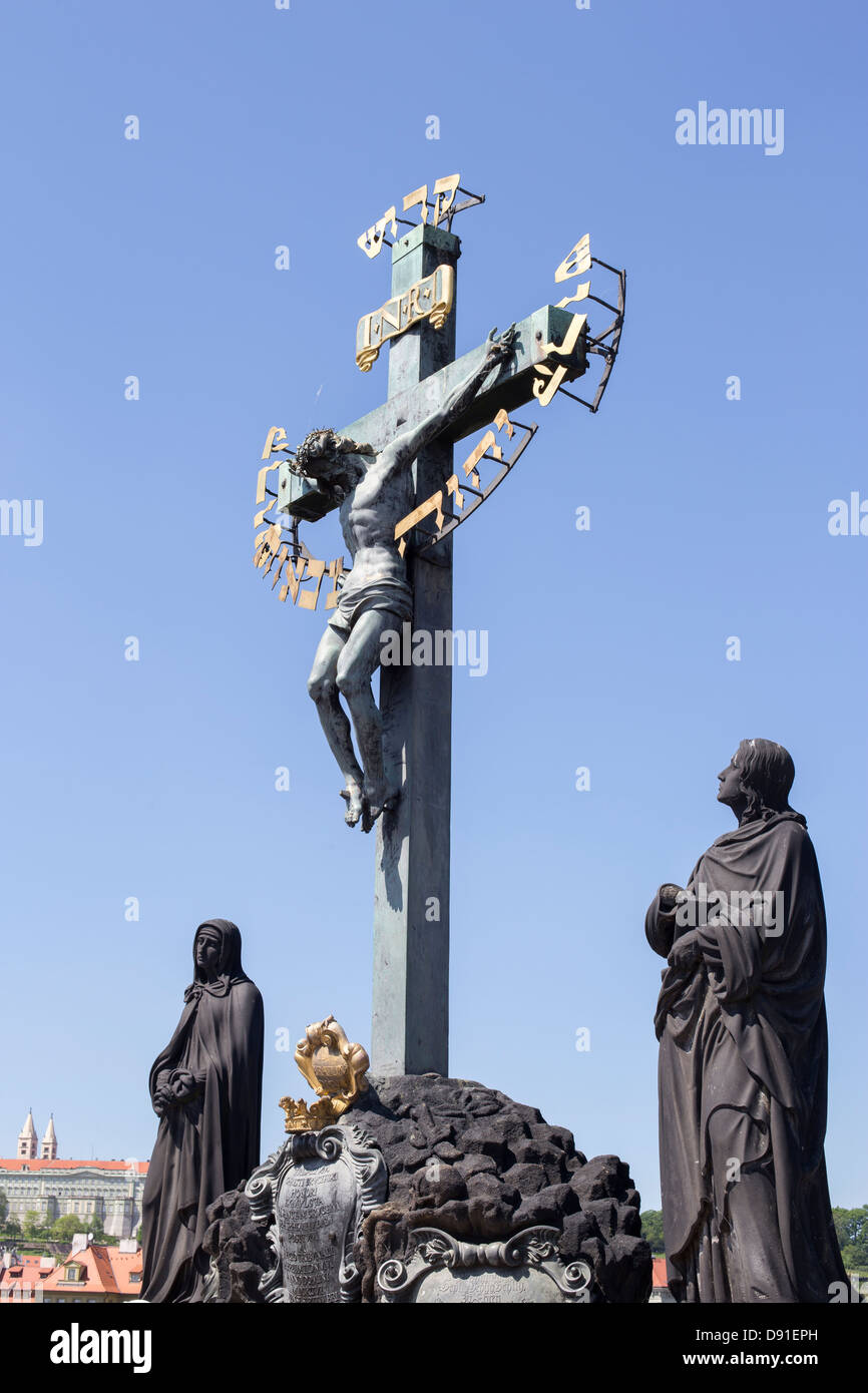 A sculpture of Jesus Christ on the cross on the famous Charles Bridge ...