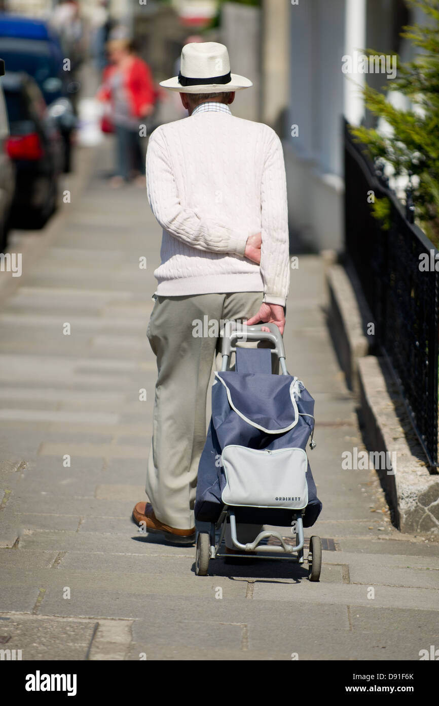 Pulling shopping trolley hi-res stock photography and images - Alamy