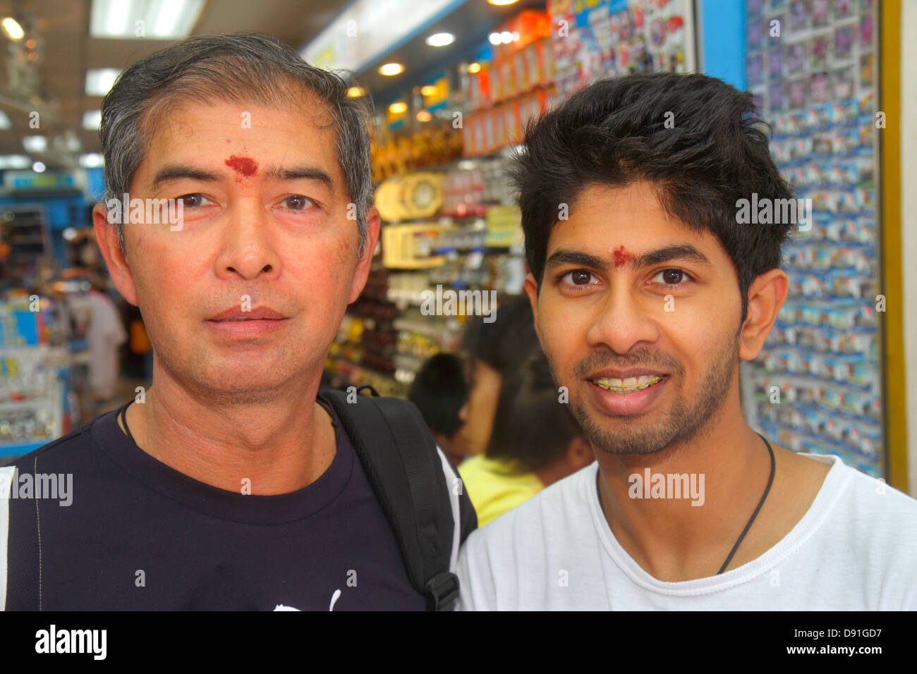 Singapore Little India Asian man friends bindi red dot Hindu Stock ...
