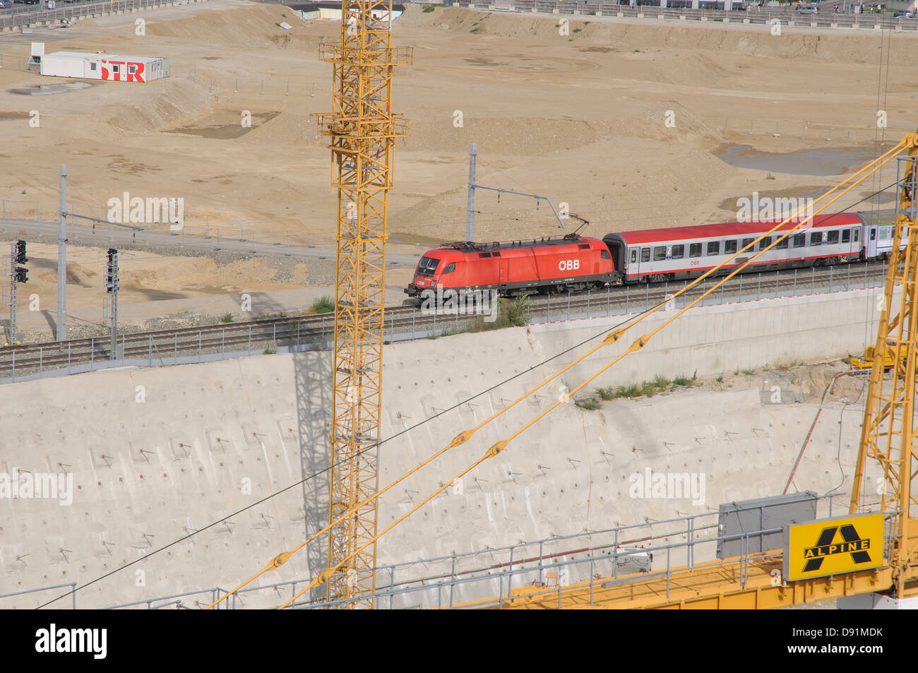 Train driving through the construction site of Vienna Central Station ...