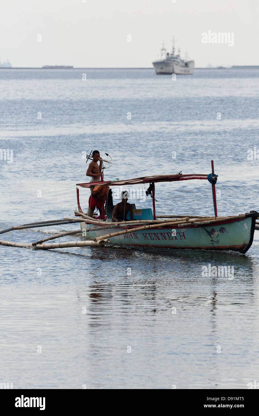 Traditional Outrigger Boat in Manila Bay, Philippines Stock Photo - Alamy