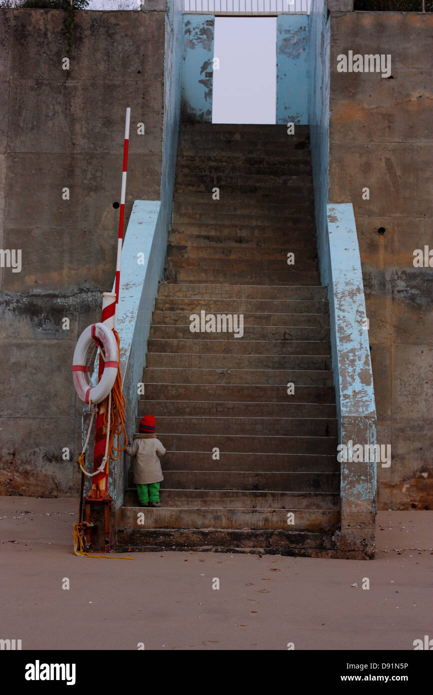 A 2 year old boy at a beach in winter. Jincheng, Kinmen County, Taiwan ...