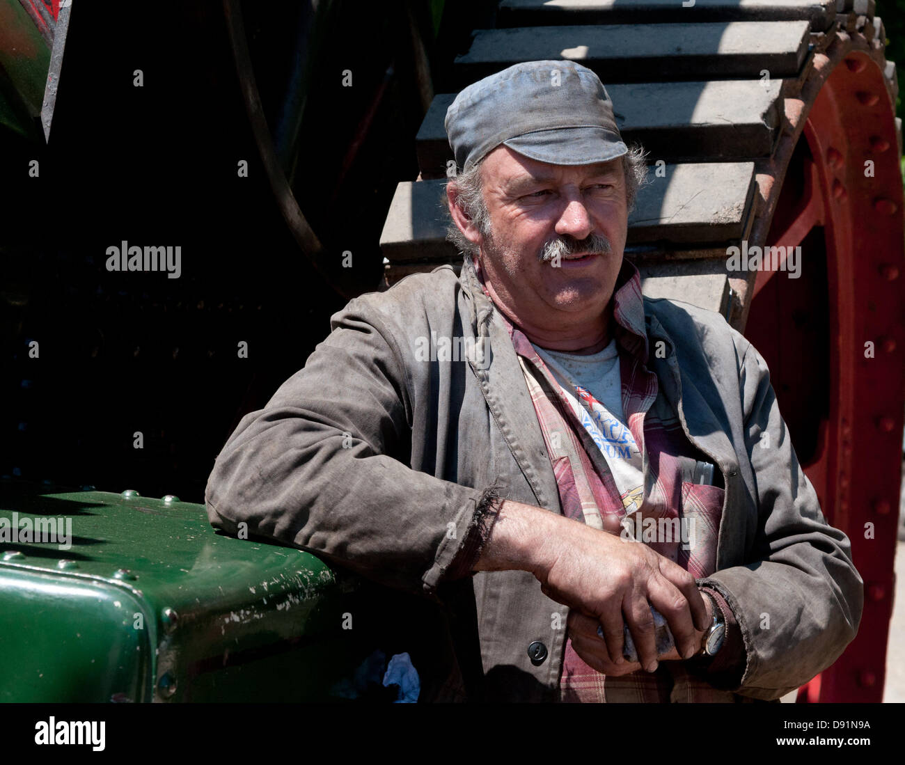 Hampshire, England, UK. 8th June 2013. The steersman of a steam ...