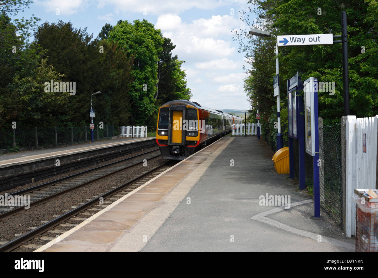 Passenger train traveling through Edale railway station, Peak District ...