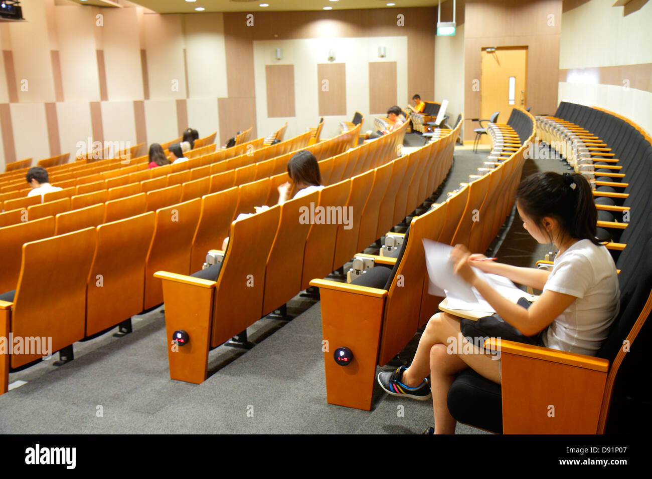 Auditorium seats woman hi-res stock photography and images - Alamy