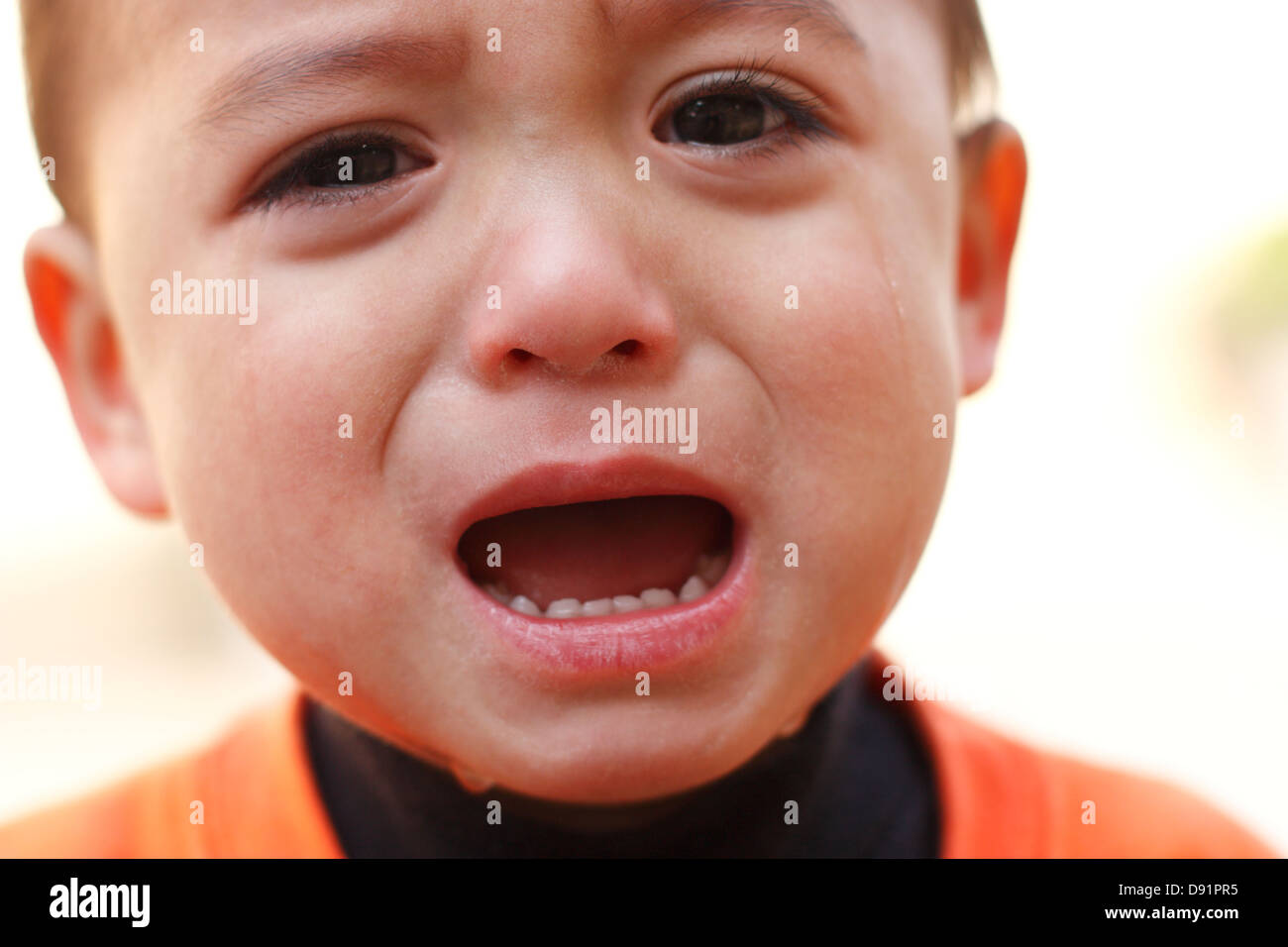 A two year old boy crying Stock Photo - Alamy