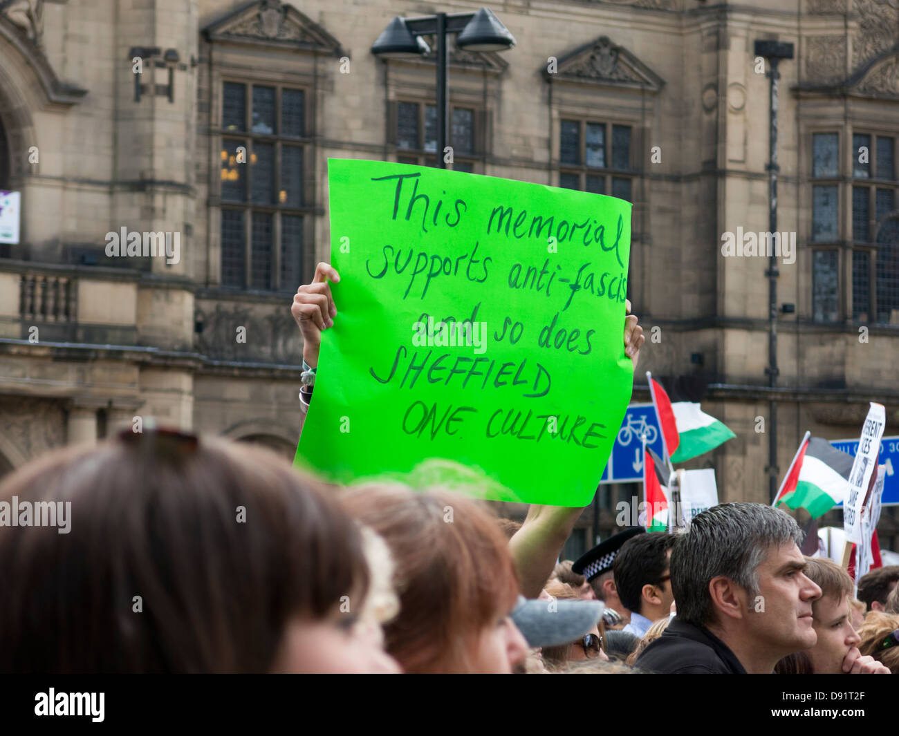 Person holds up placard during protest against EDL supporters in ...