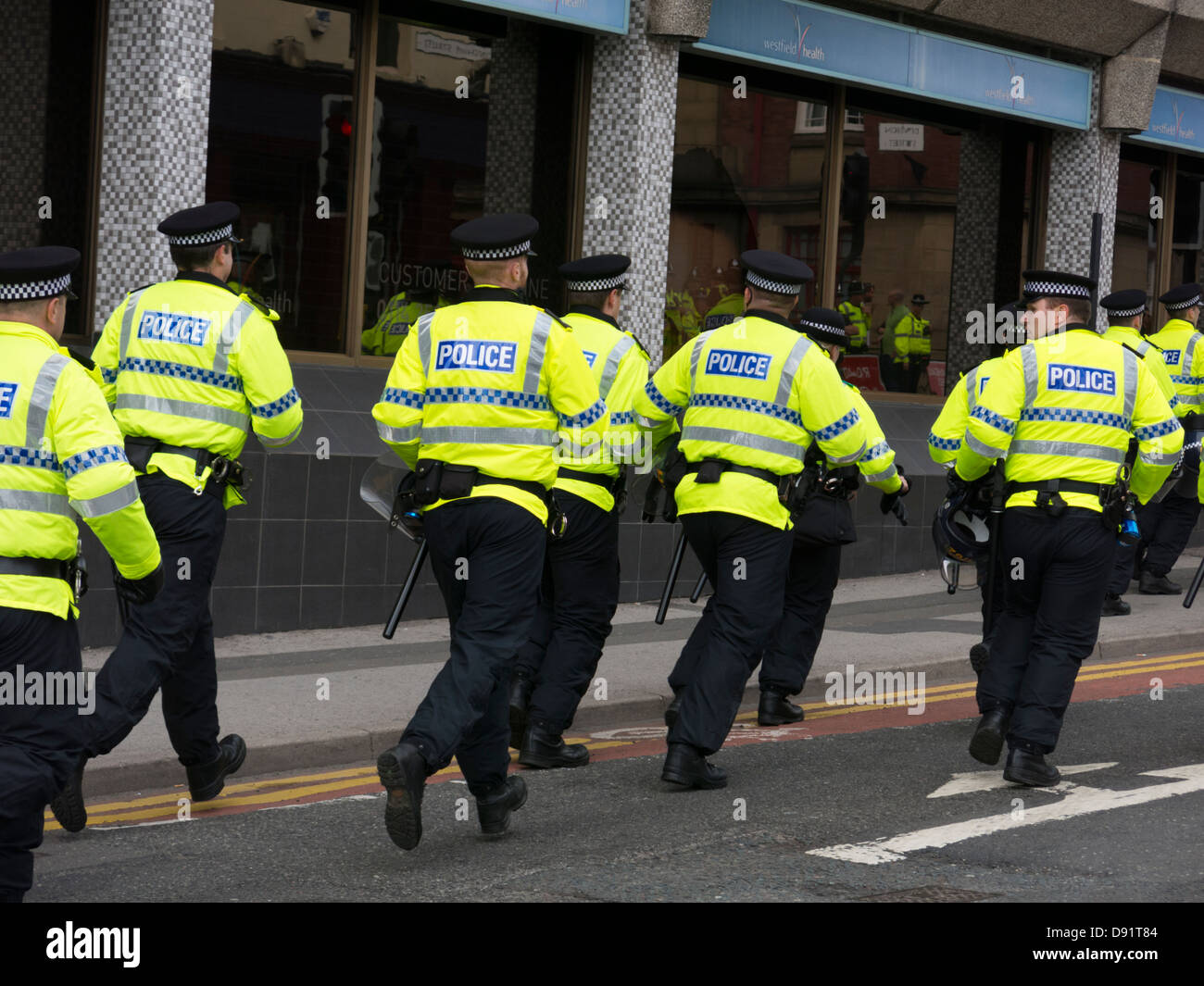 Police support running to help during protest by EDL supporters in ...