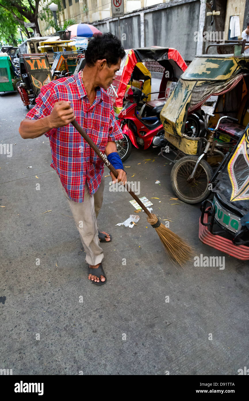 Road Sweeper in Manila, Philippines Stock Photo - Alamy