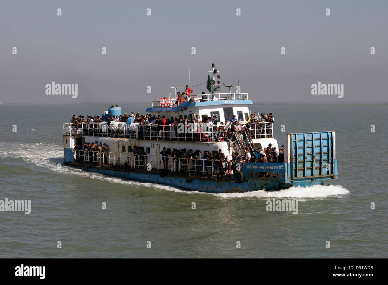Overcrowded sea ferry on the way from the mainland to Saint Martin ...
