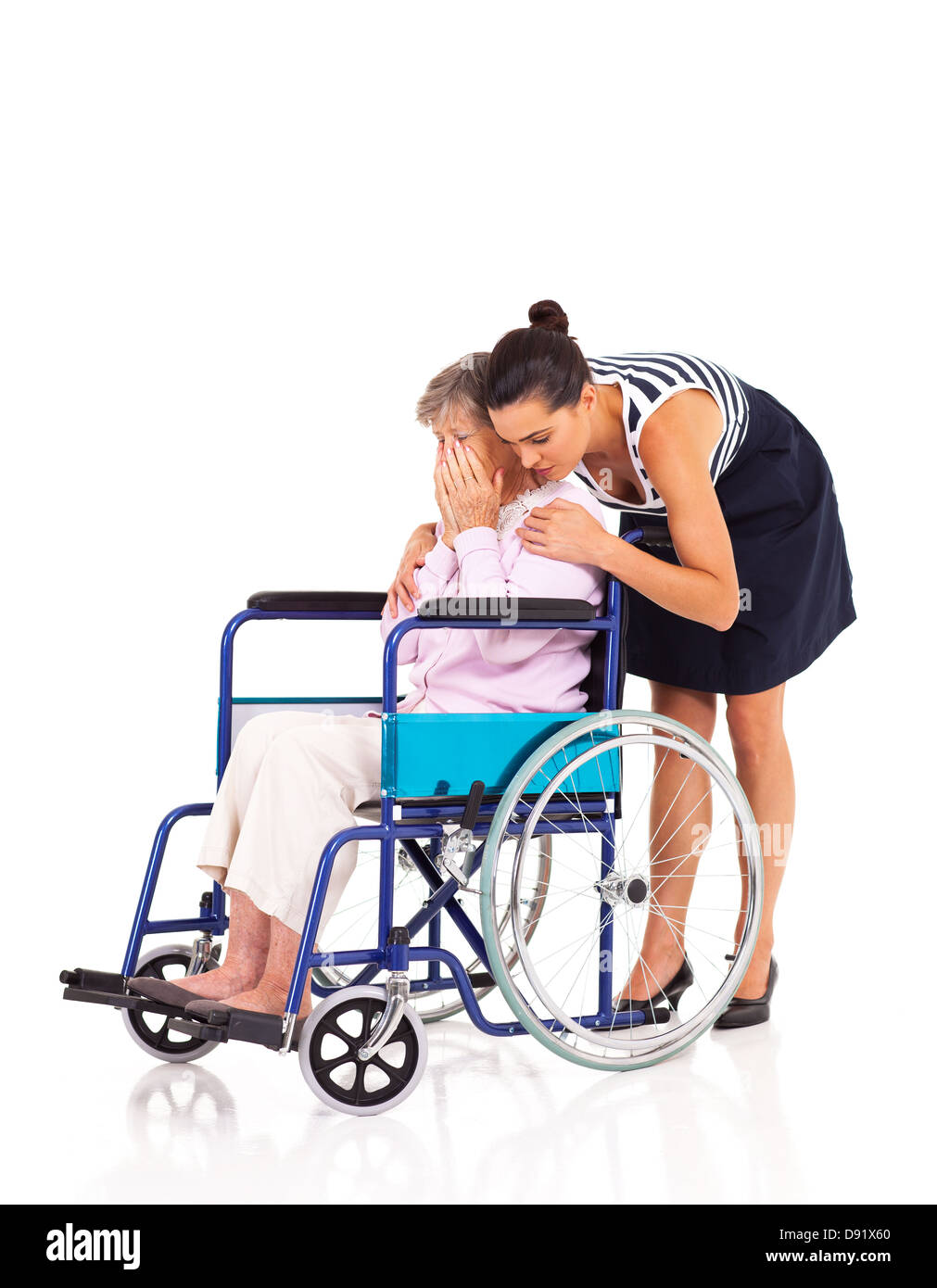 Young Female Caregiver Hugging And Comforting Lonely Disabled Senior