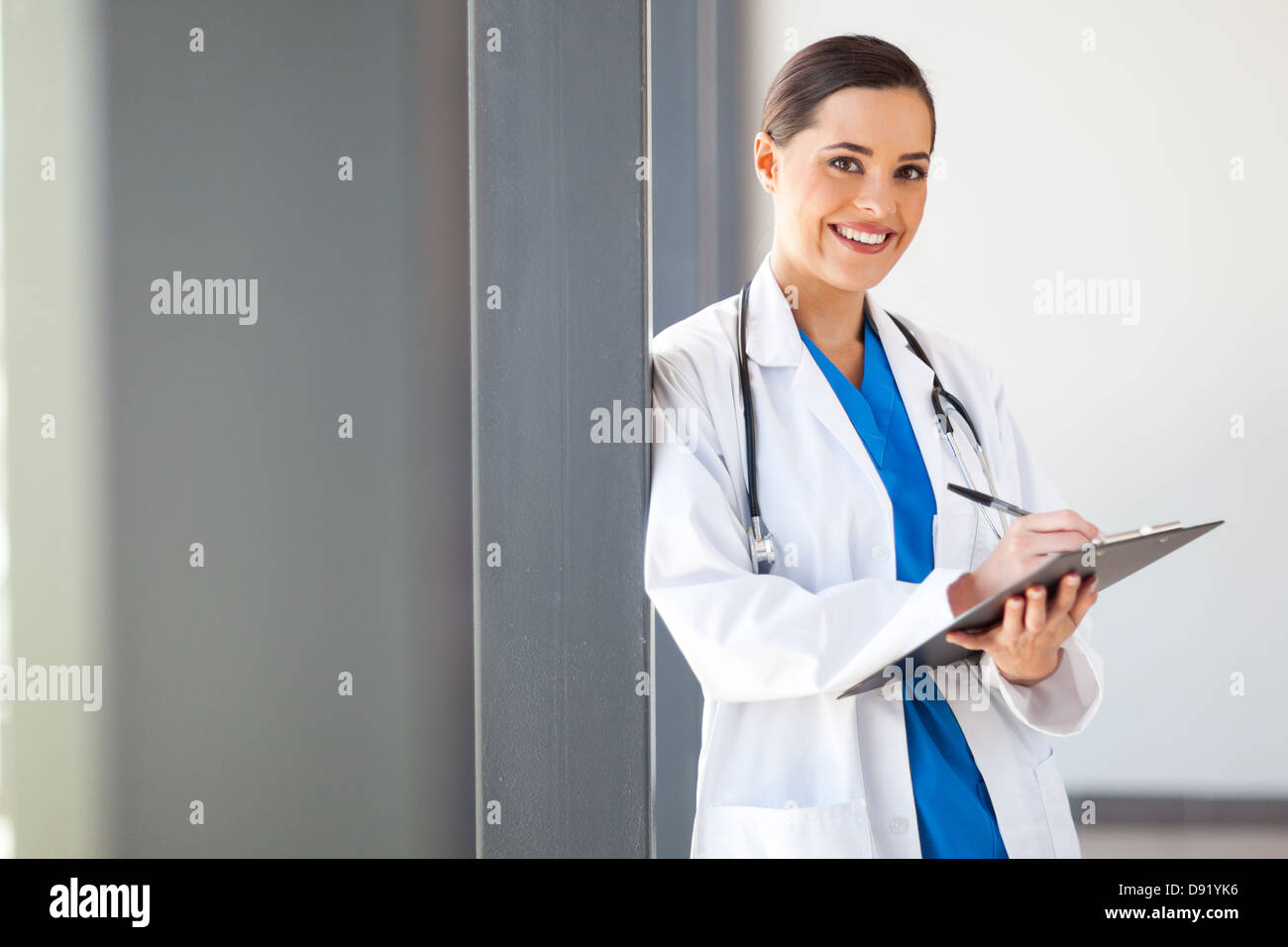 female medical worker writing report in office Stock Photo - Alamy