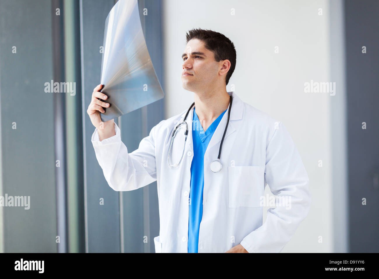medical doctor looking at x-ray film in hospital Stock Photo - Alamy